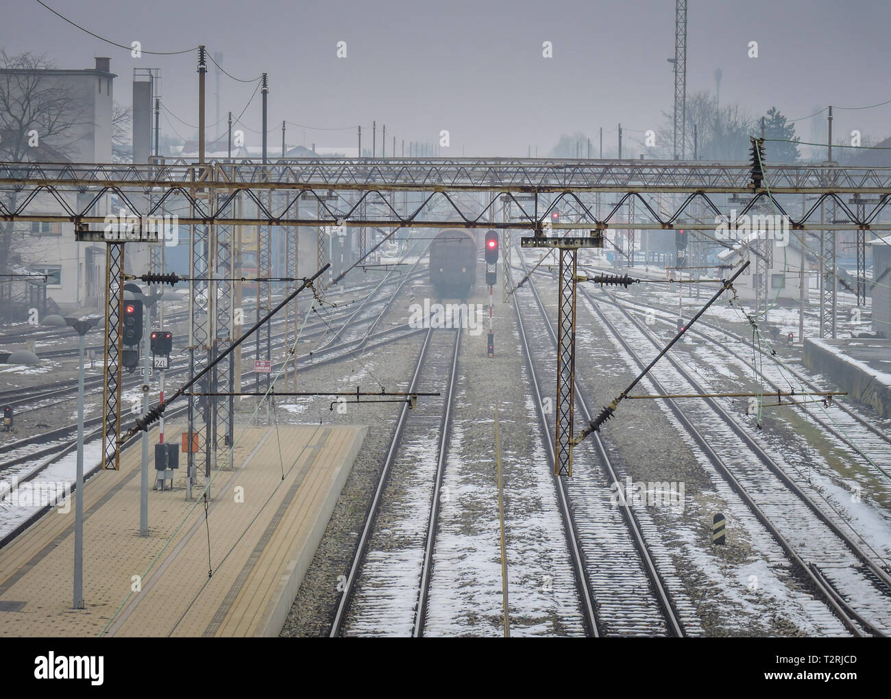 Railroad station in winter time with old tracks Stock Photo - Alamy