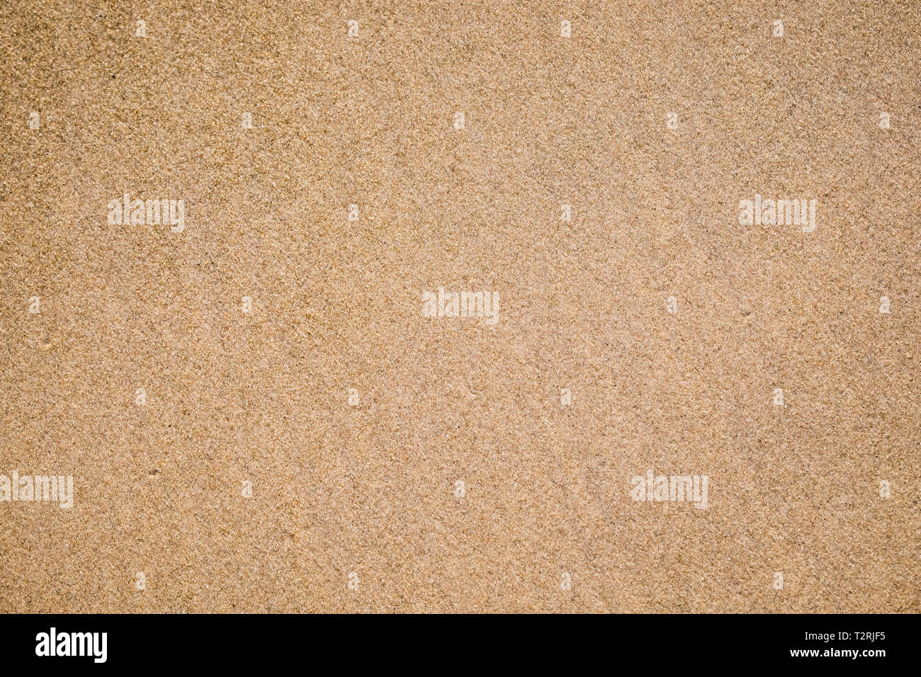 Golden brown sand on the beach Stock Photo - Alamy