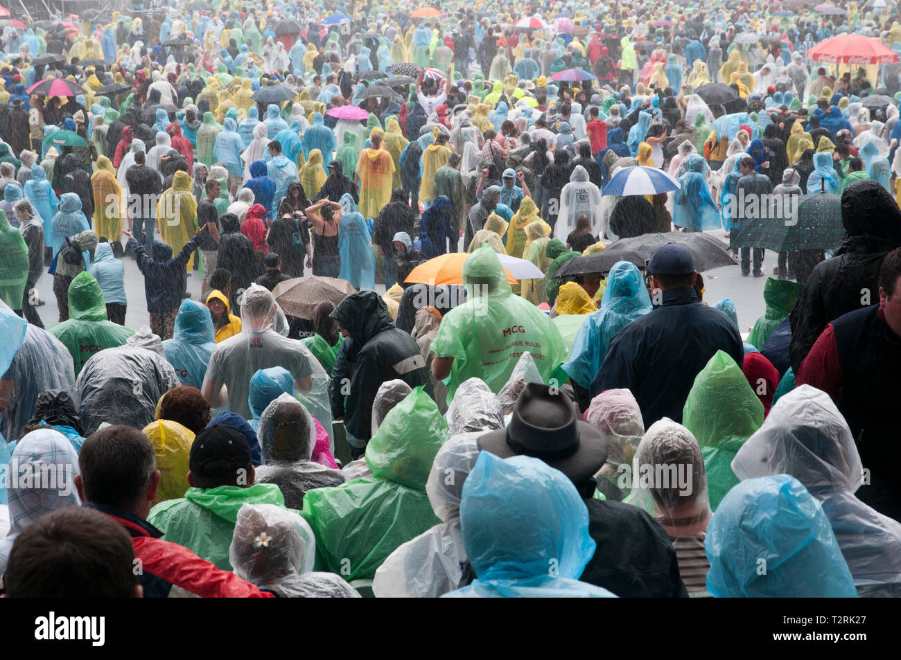 Crowds standing in the pouring rain at rock concert Stock Photo - Alamy