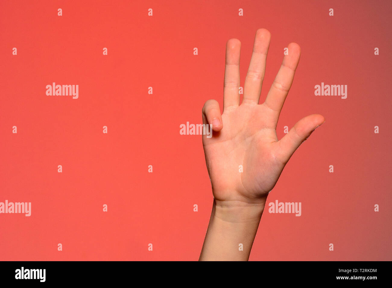 The human hand shows four fingers isolated on a red background 2019 ...