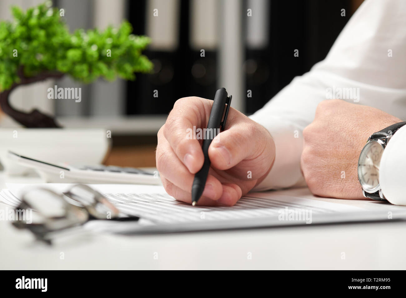 Businessman working in office and calculating finance. Business ...