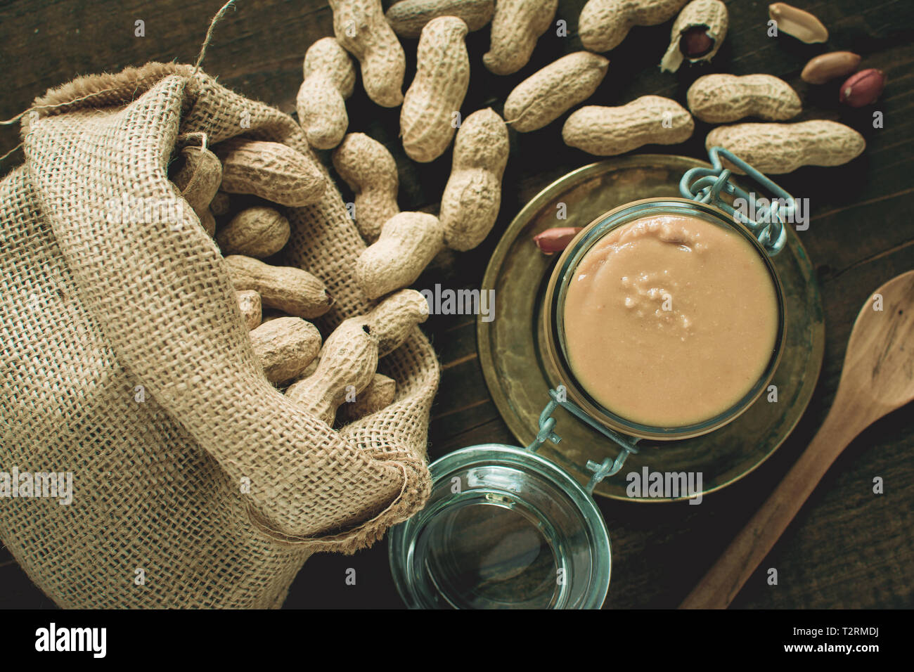 Organic Peanut Butter in Glass Jar with Peanuts in Shell on Wooden ...