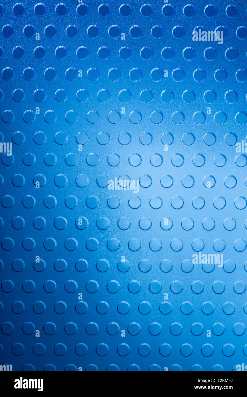 Abstract blue dots, bumps and circles. Close-up macro shot of backlit ...
