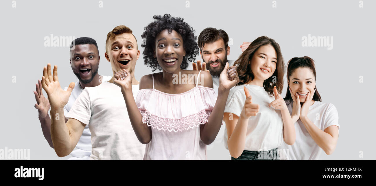 The collage of faces of surprised people on white studio backgrounds ...