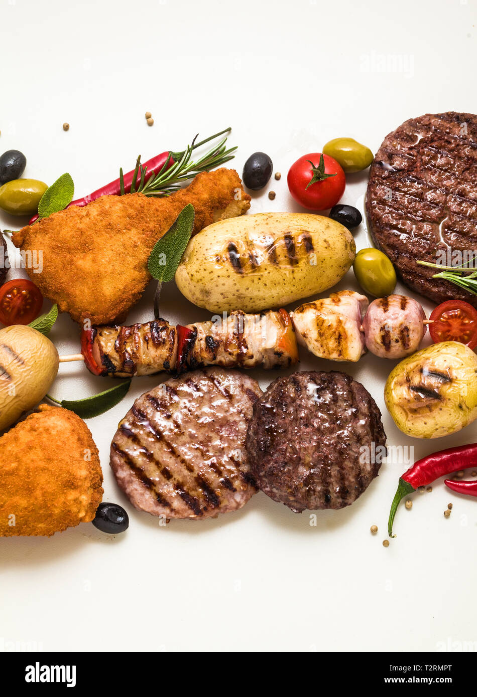 BBQ meat party with different types of meat: beef burgers, pork ribs ...