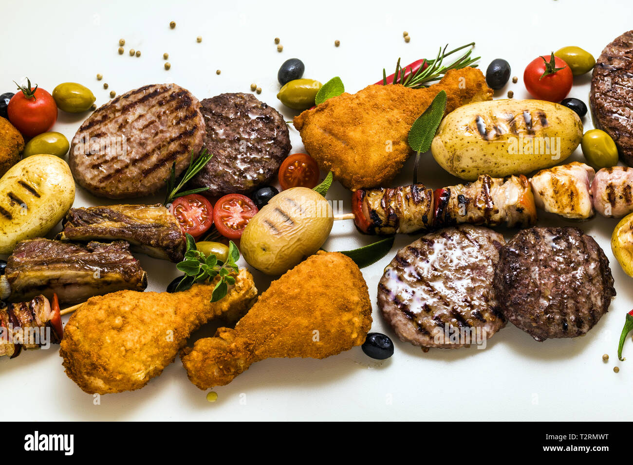 BBQ meat party with different types of meat: beef burgers, pork ribs ...