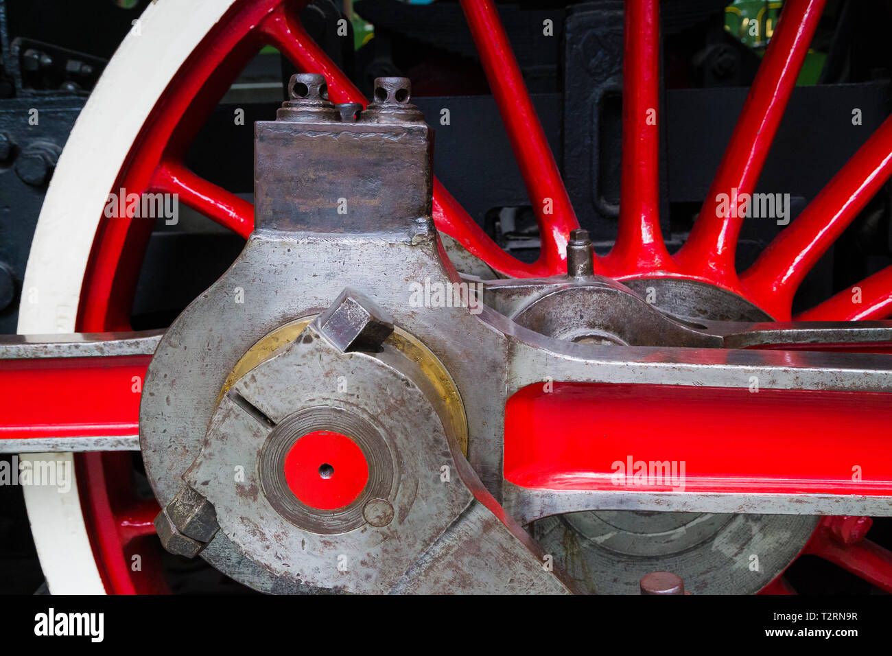 National Rail Museum, York. A closeup view of a red steam engine wheel ...