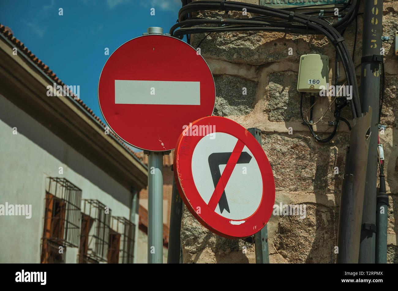 NO ENTRY and RIGHT TURN AHEAD PROHIBITED traffic signs in front of ...