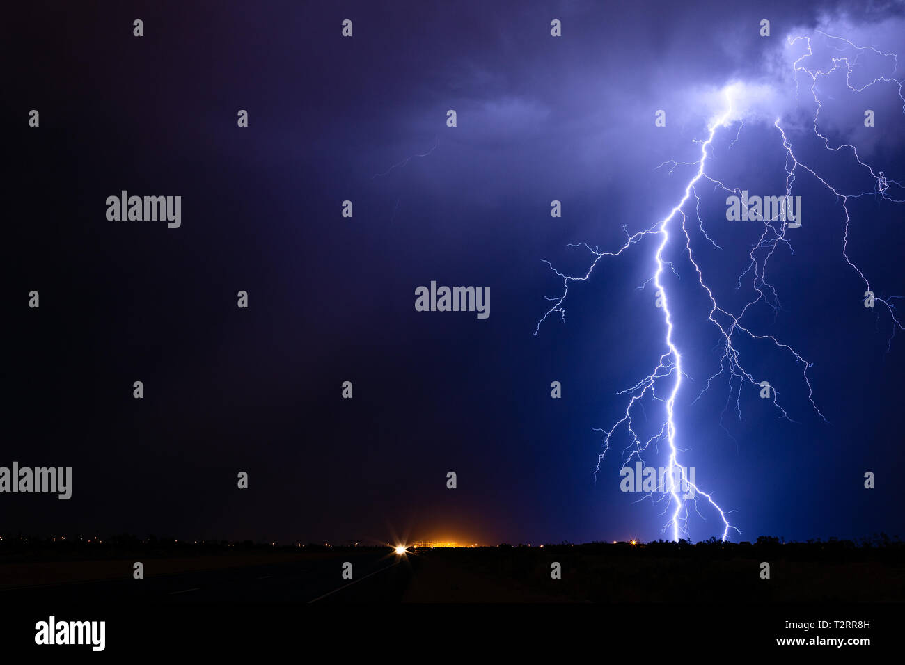 A dramatic lightning bolt strike from a monsoon thunderstorm near ...