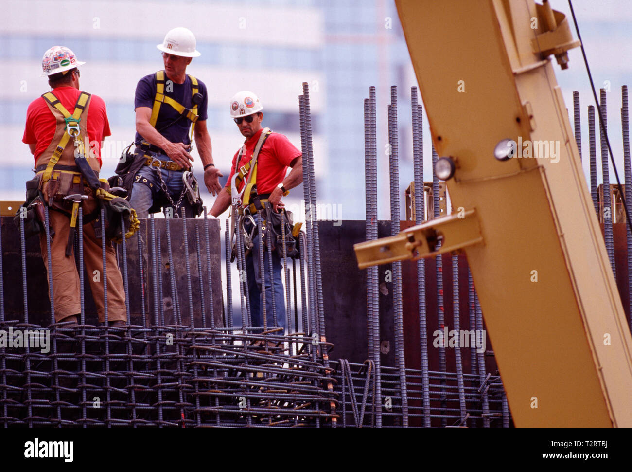 Field workers working with rebar on new building construction in ...