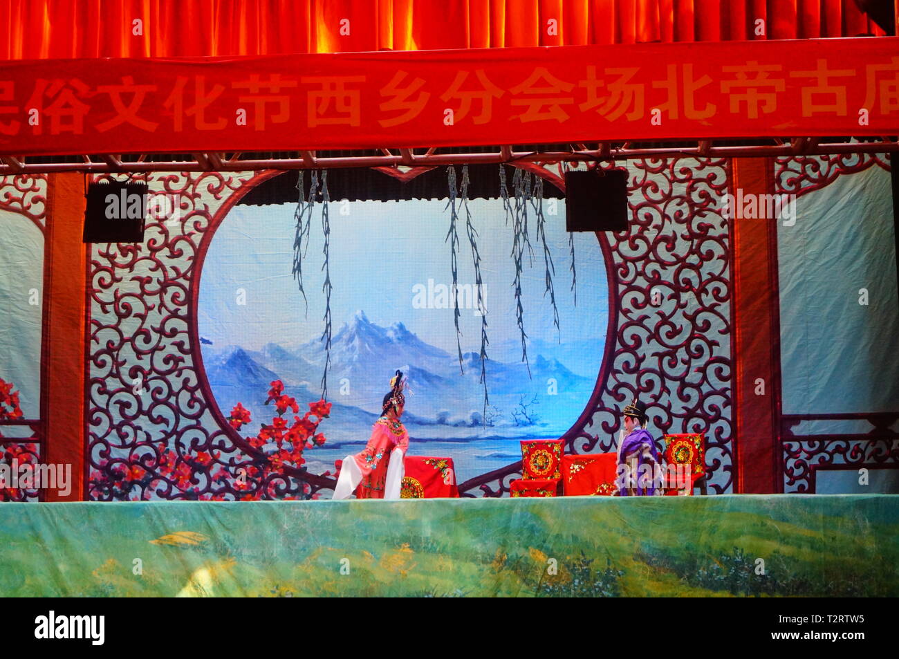 Shenzhen, China: people watch a traditional puppet show at the ...