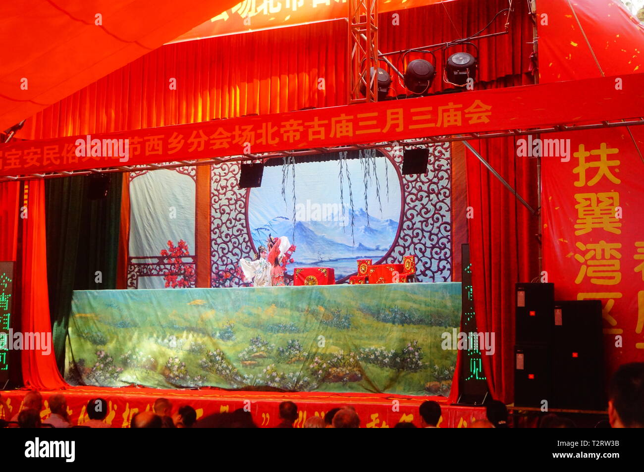 Shenzhen, China: people watch a traditional puppet show at the ...