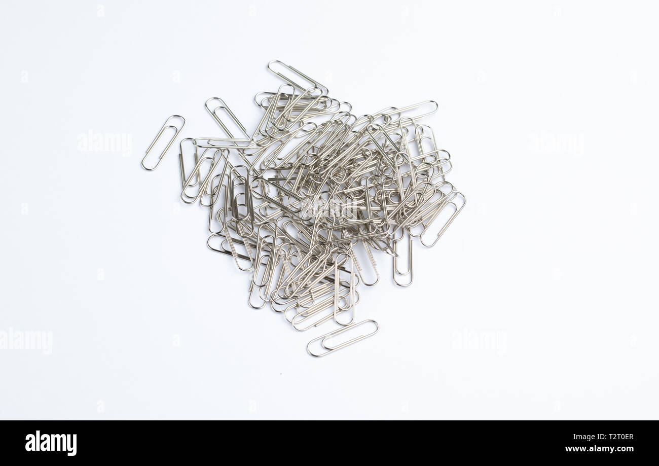 Pile of Steel paper Clips on White Background Stock Photo - Alamy