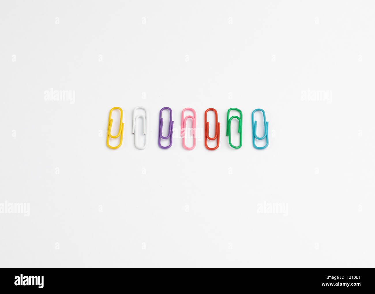 Row of Coloured paper Clips on White Background Stock Photo - Alamy