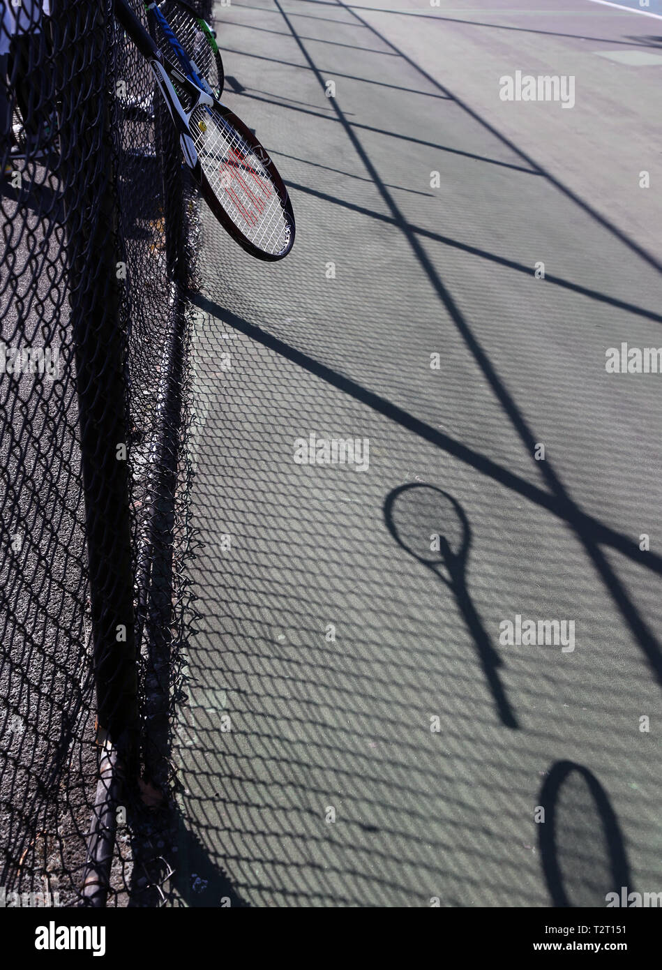 Shadows of tennis rackets on the ground Stock Photo - Alamy