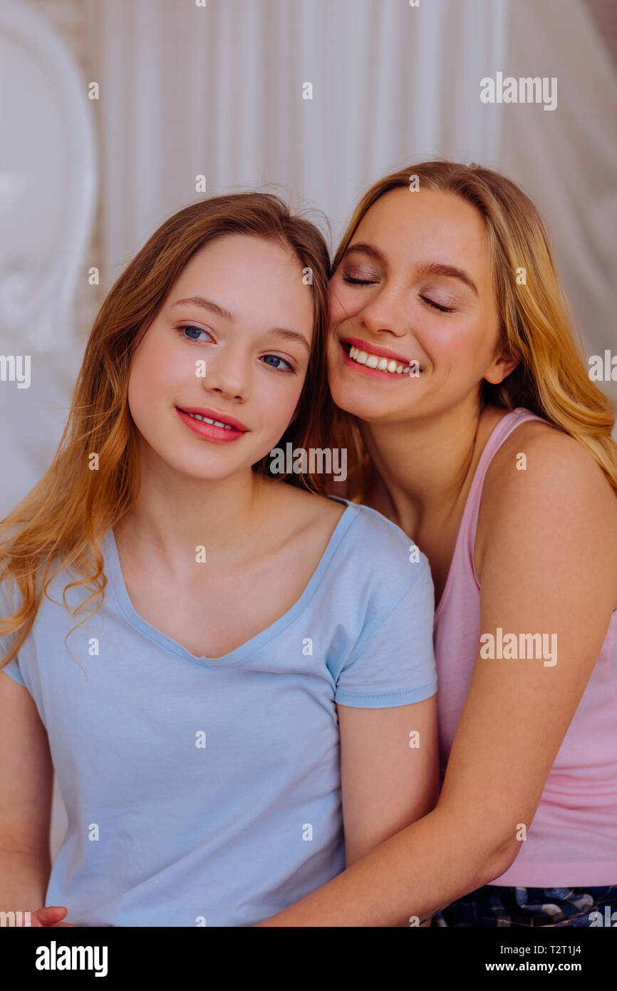 Feeling relieved. Older sister feeling relieved after coming home and ...