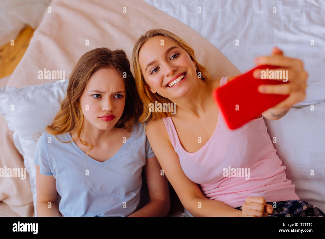 Sister Feeling Bored Blue Eyed Teenage Sister Feeling Bored While Making Photo With Older