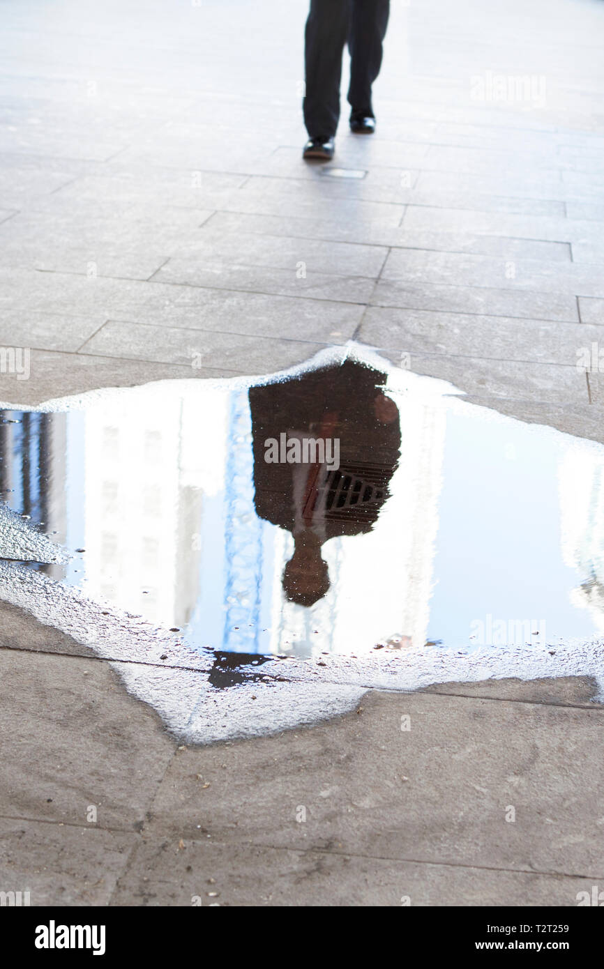 Shoe foot puddle hi-res stock photography and images - Alamy
