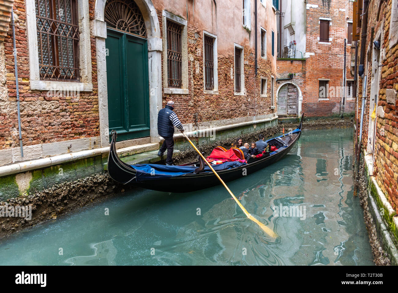 Canal in Venice with gondola, Italy Stock Photo - Alamy