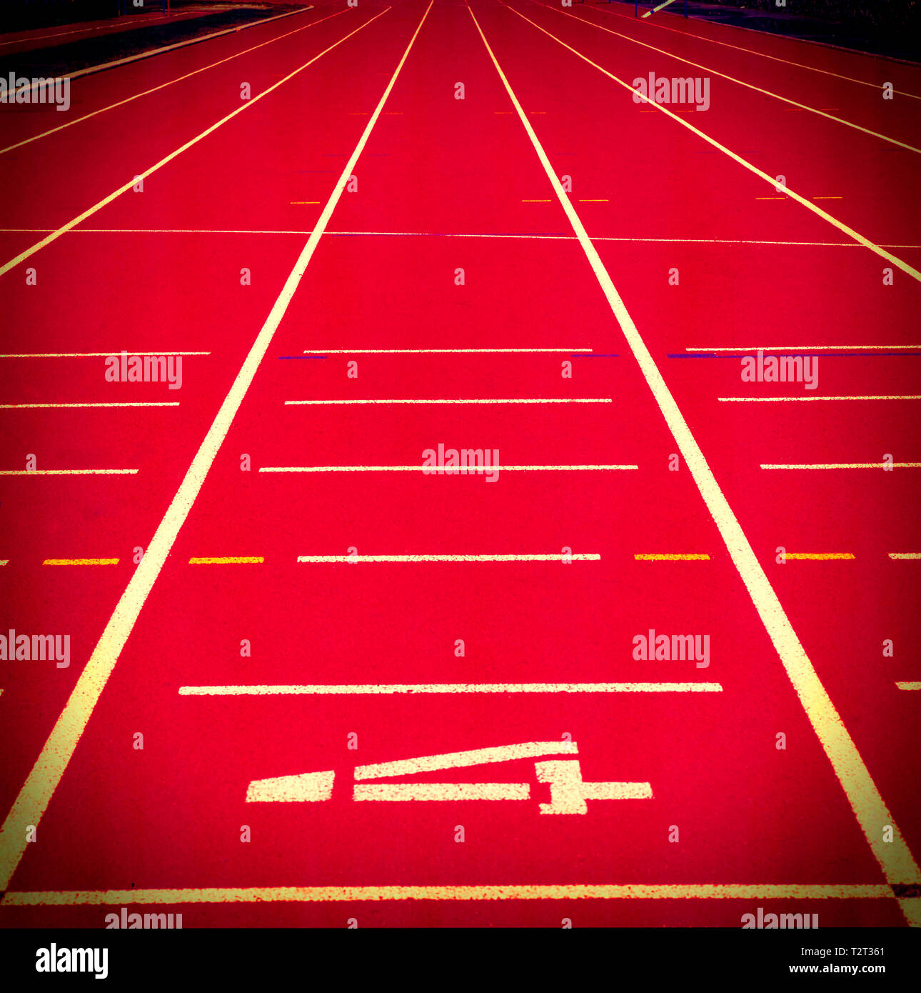 Running track and number 4 Stock Photo - Alamy