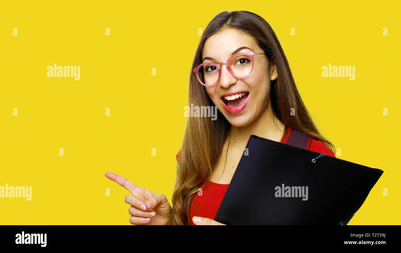 Portrait of beautiful long hair female student wearing red t-shirt and ...