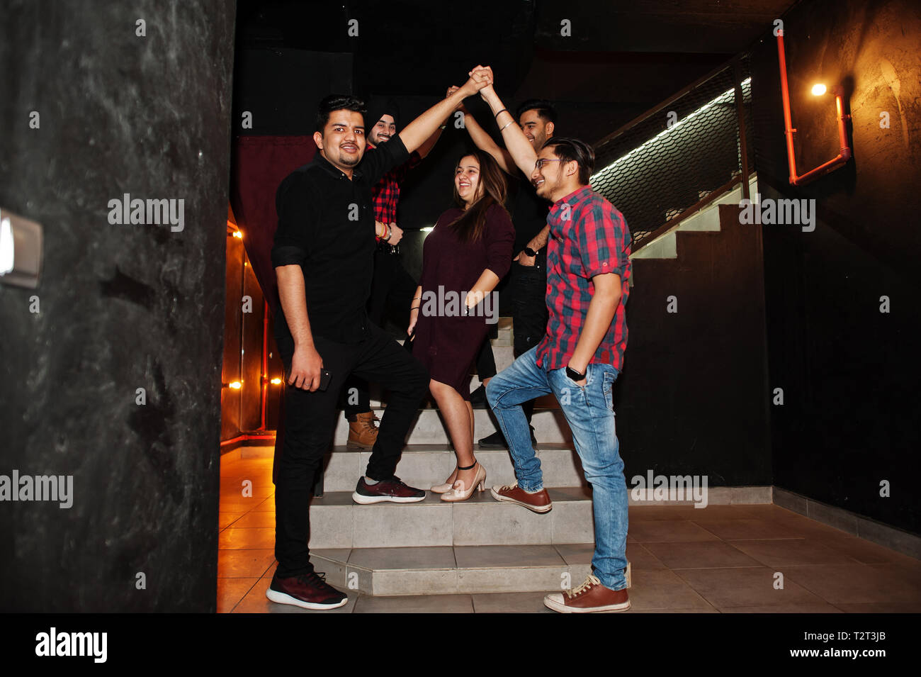 Group of indian friends having fun and rest at night club Stock Photo ...
