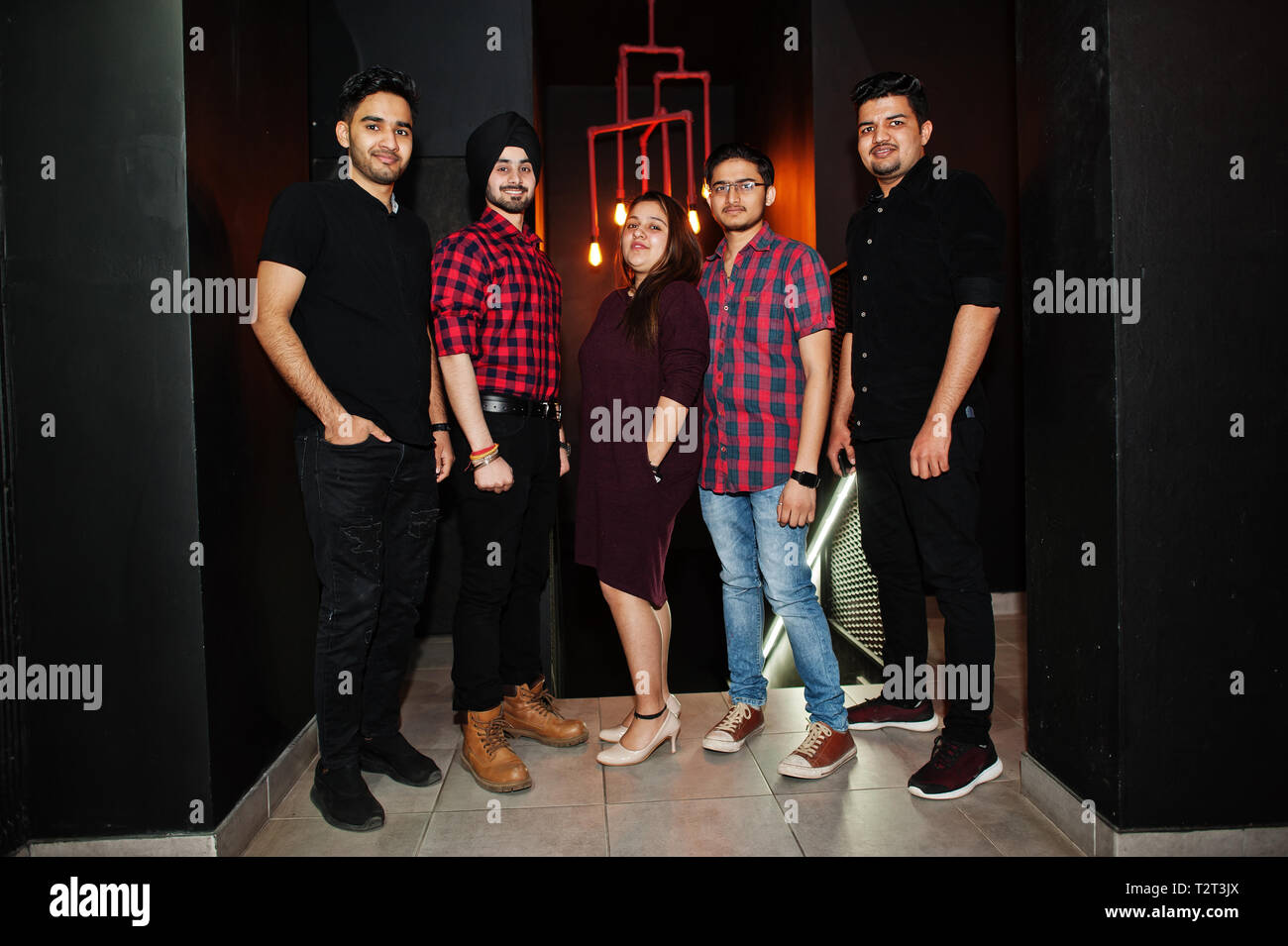 Group of indian friends having fun and rest at night club Stock Photo ...