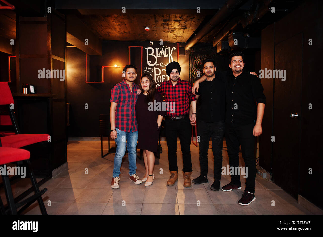 Group of indian friends having fun and rest at night club Stock Photo ...