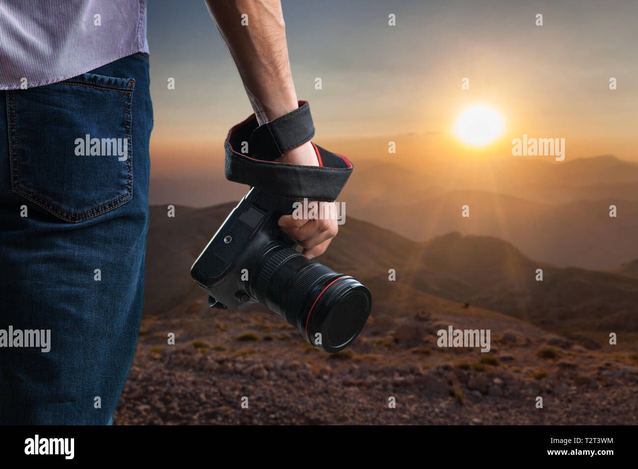 Young black man holds camera hi-res stock photography and images - Alamy