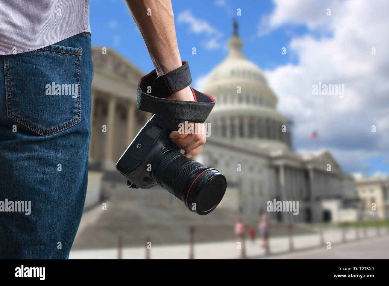 Young black man holds camera hi-res stock photography and images - Alamy