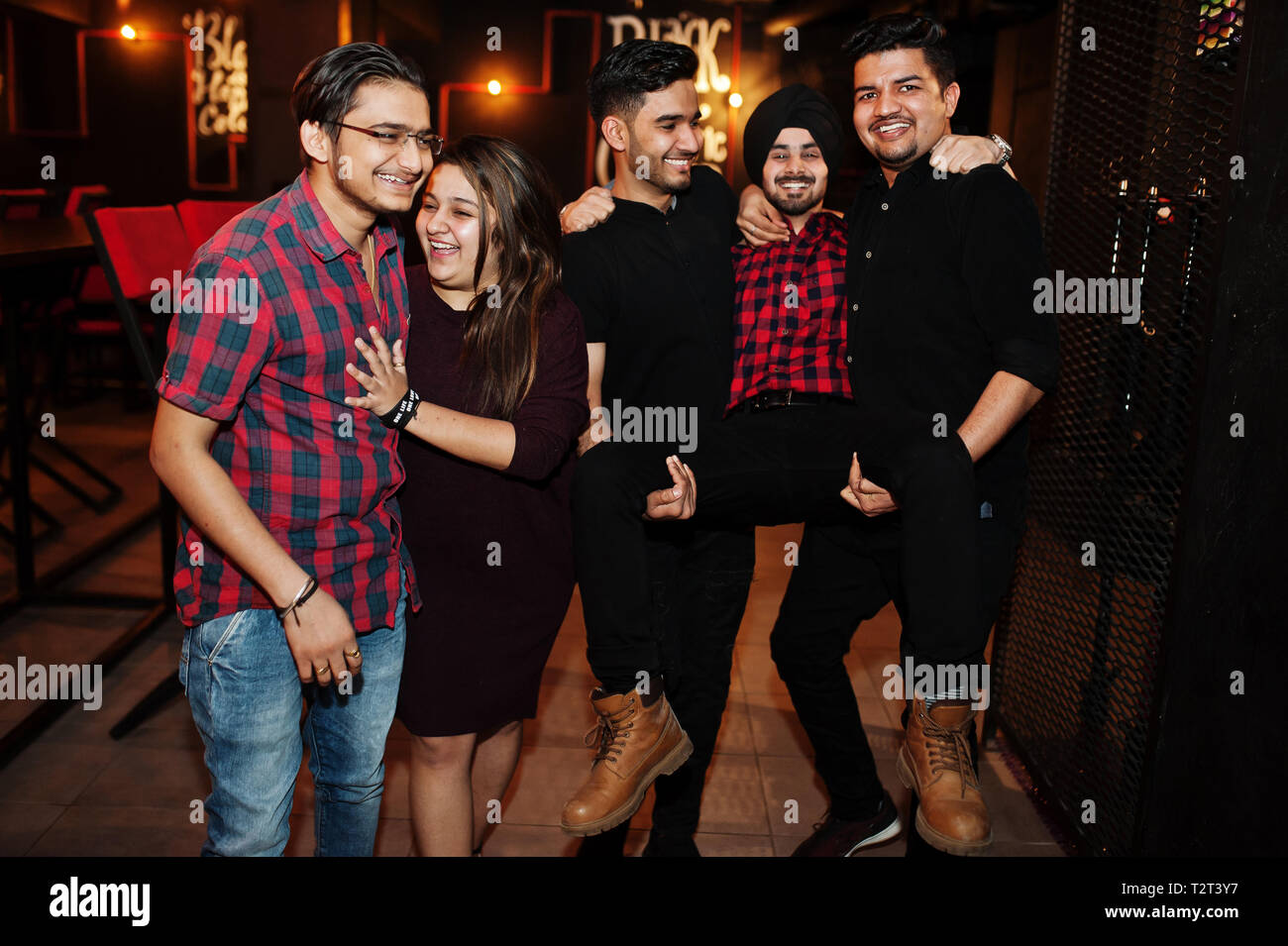 Group of indian friends having fun and rest at night club Stock Photo ...