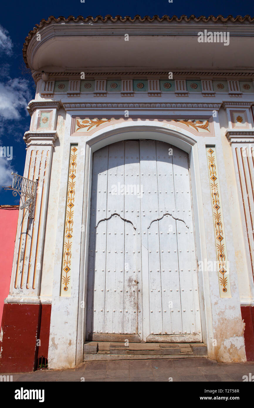 Typical colonial building with small doors in the big gate, Trinidad ...