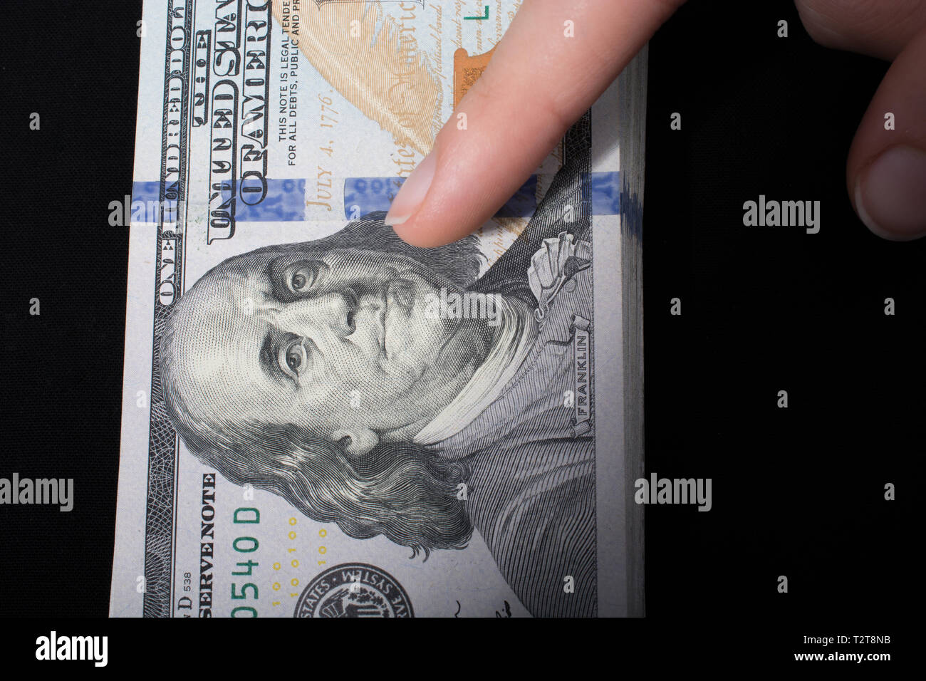 Hand holding American dollar banknotes isolated on white background ...