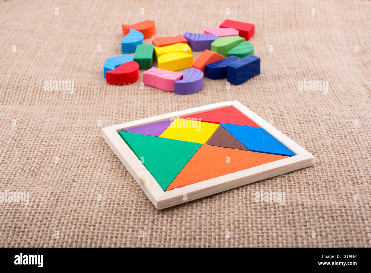 Colorful pieces of a square tangram puzzle Stock Photo - Alamy
