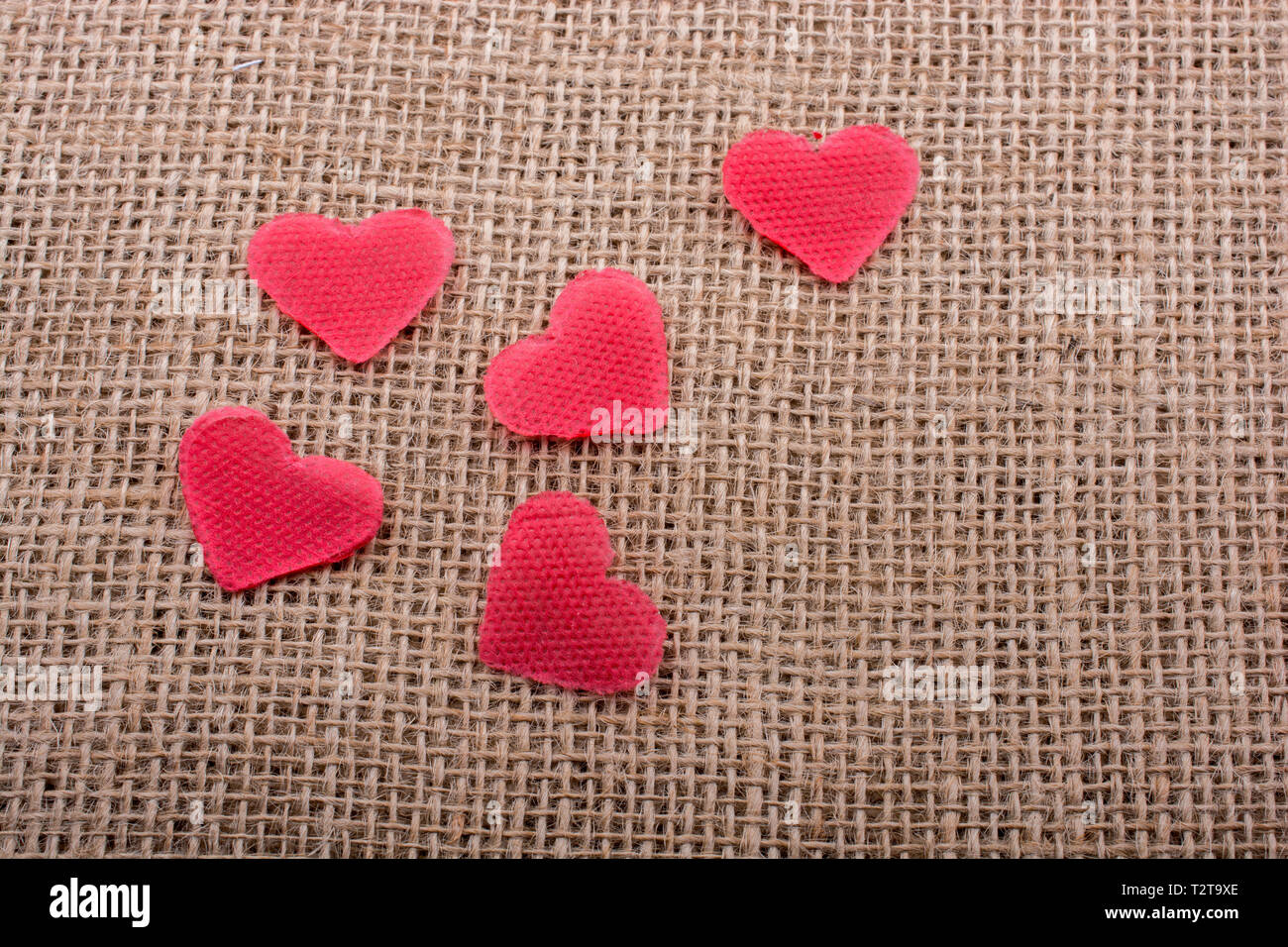 Heart shaped objects on a linen canvas Stock Photo - Alamy