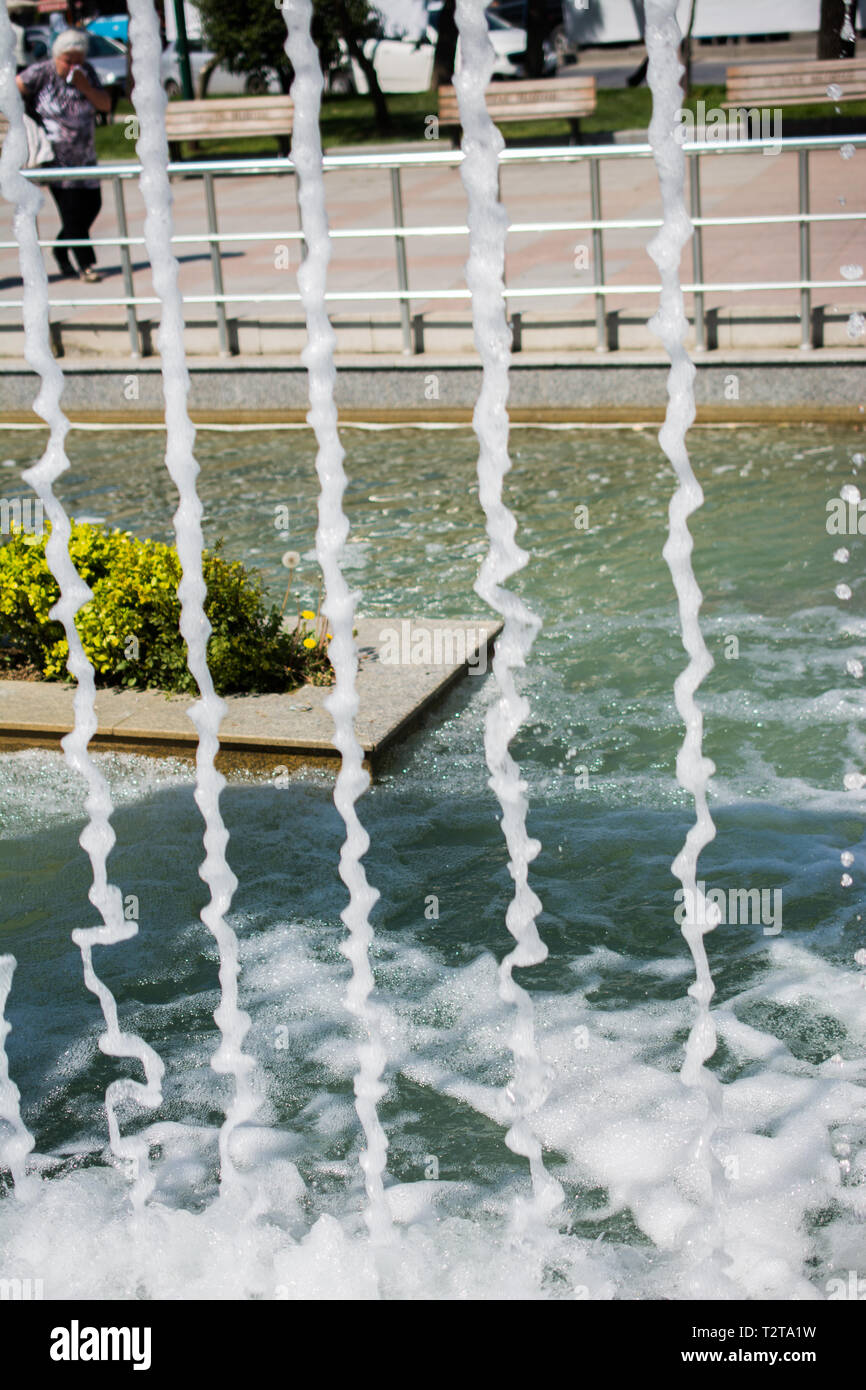 The fountains gushing sparkling water in a pool in a park Stock Photo ...