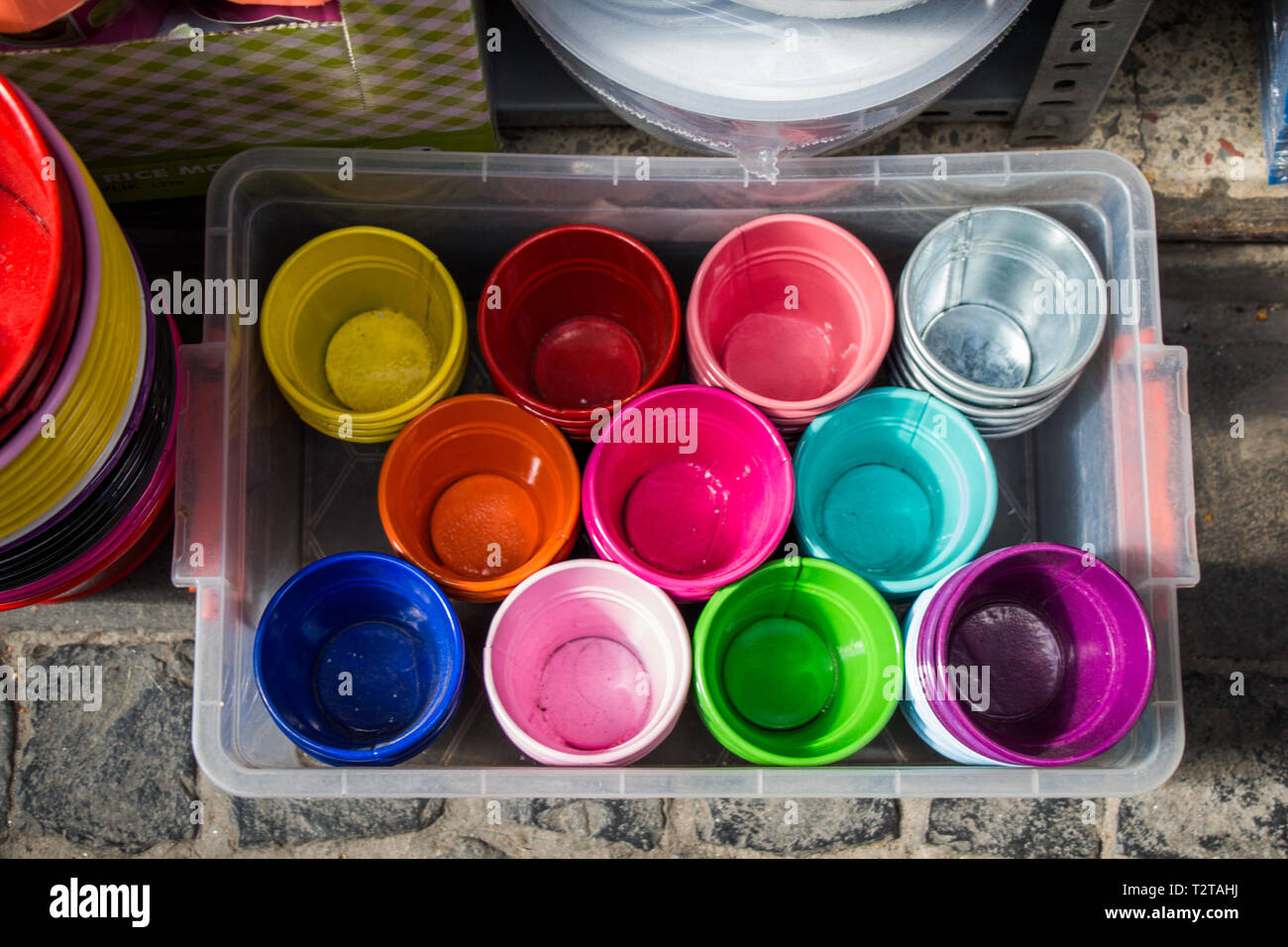 Little set of buckets of various colors in a market place Stock Photo ...
