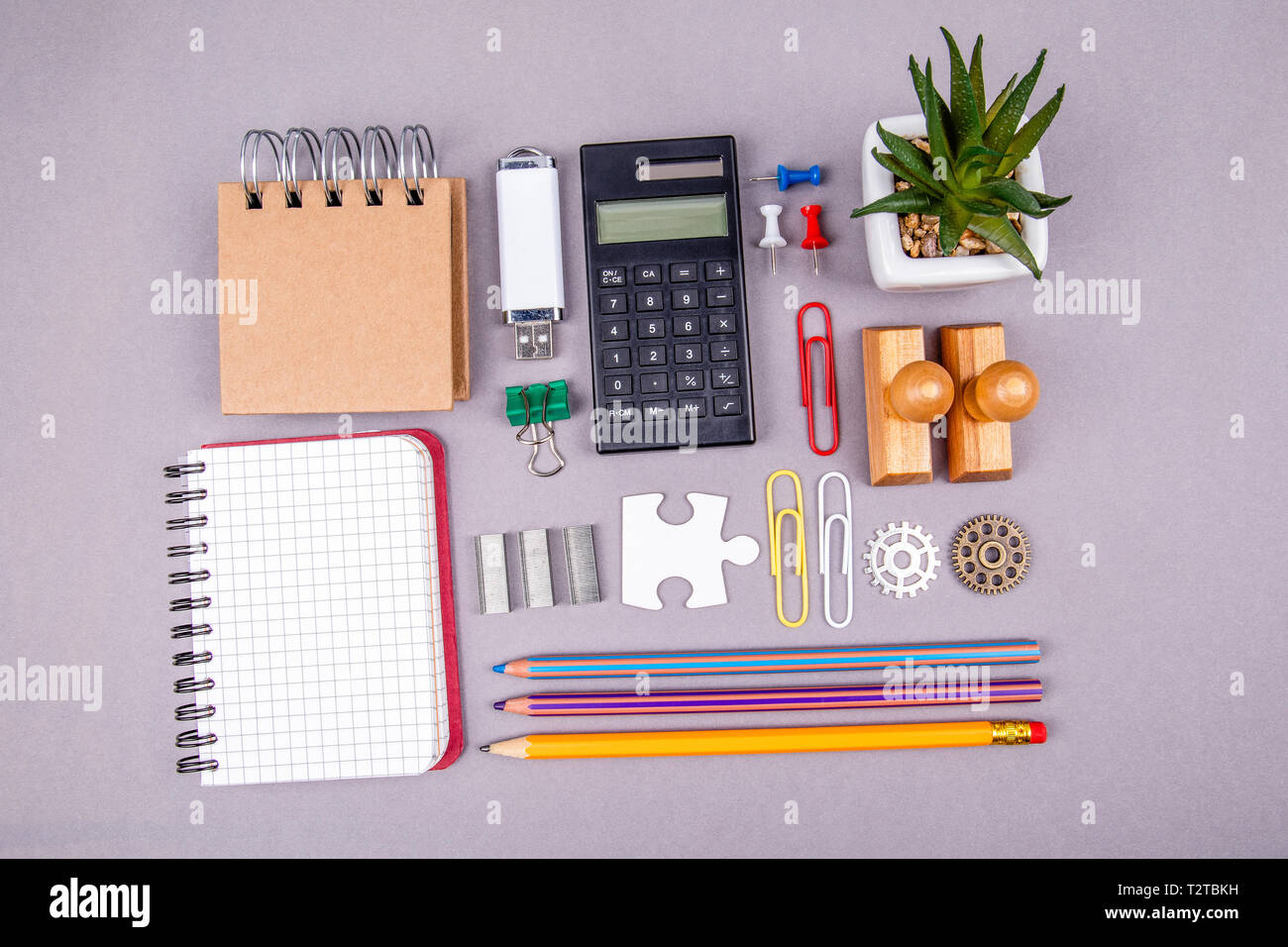 Stationery objects seen from above, top view. Gray background. Pencils ...