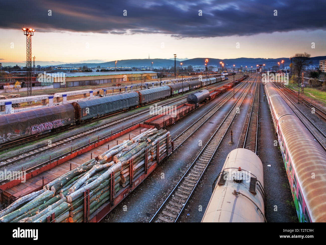 Cargo train platform at sunset with container Stock Photo - Alamy