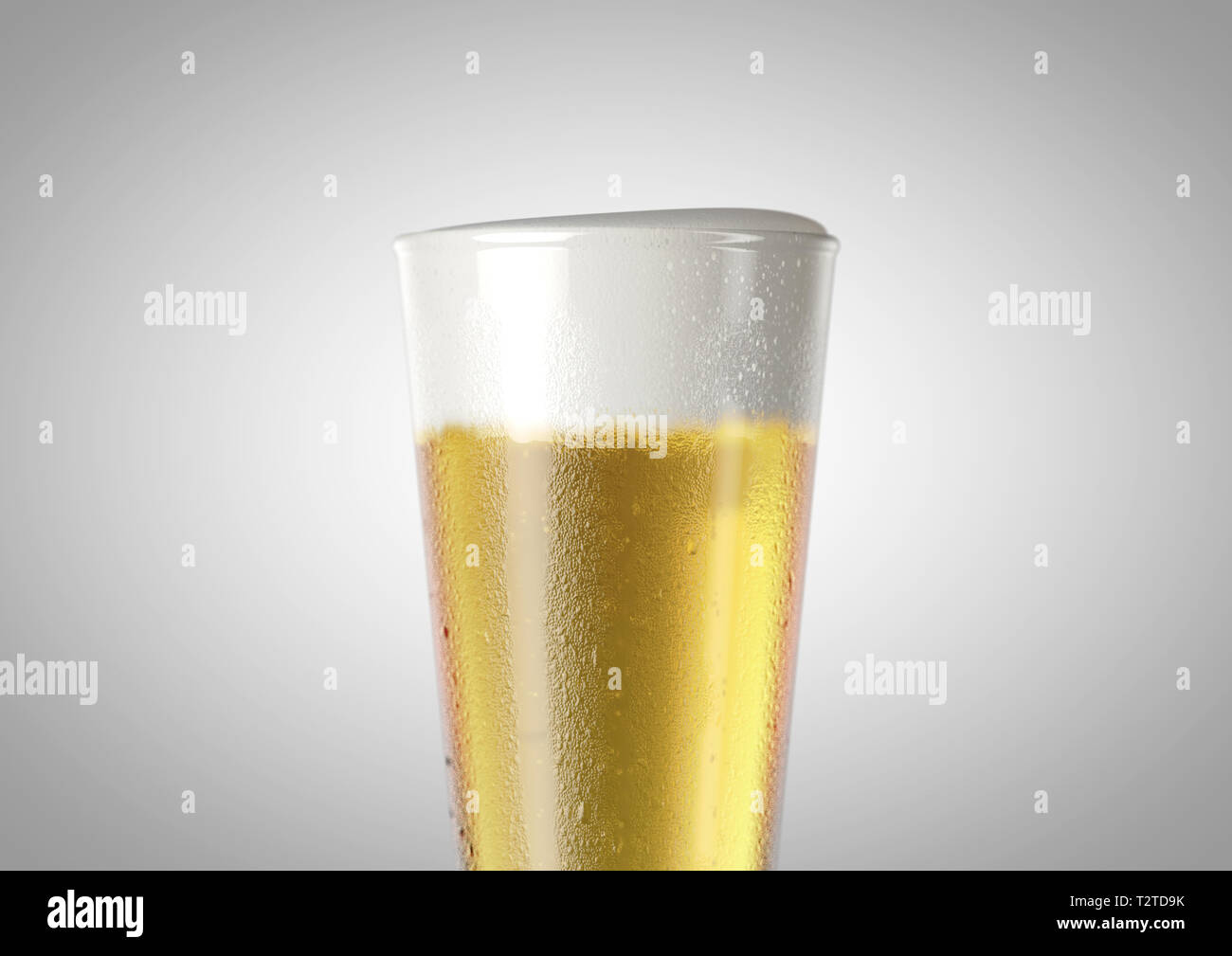 A closeup of the top half of an ice cold pilsner shaped beer glass ...