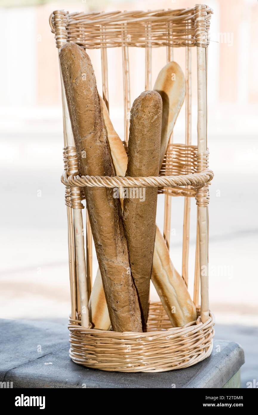 Baguette (french bread sticks) in wooden basket Stock Photo - Alamy