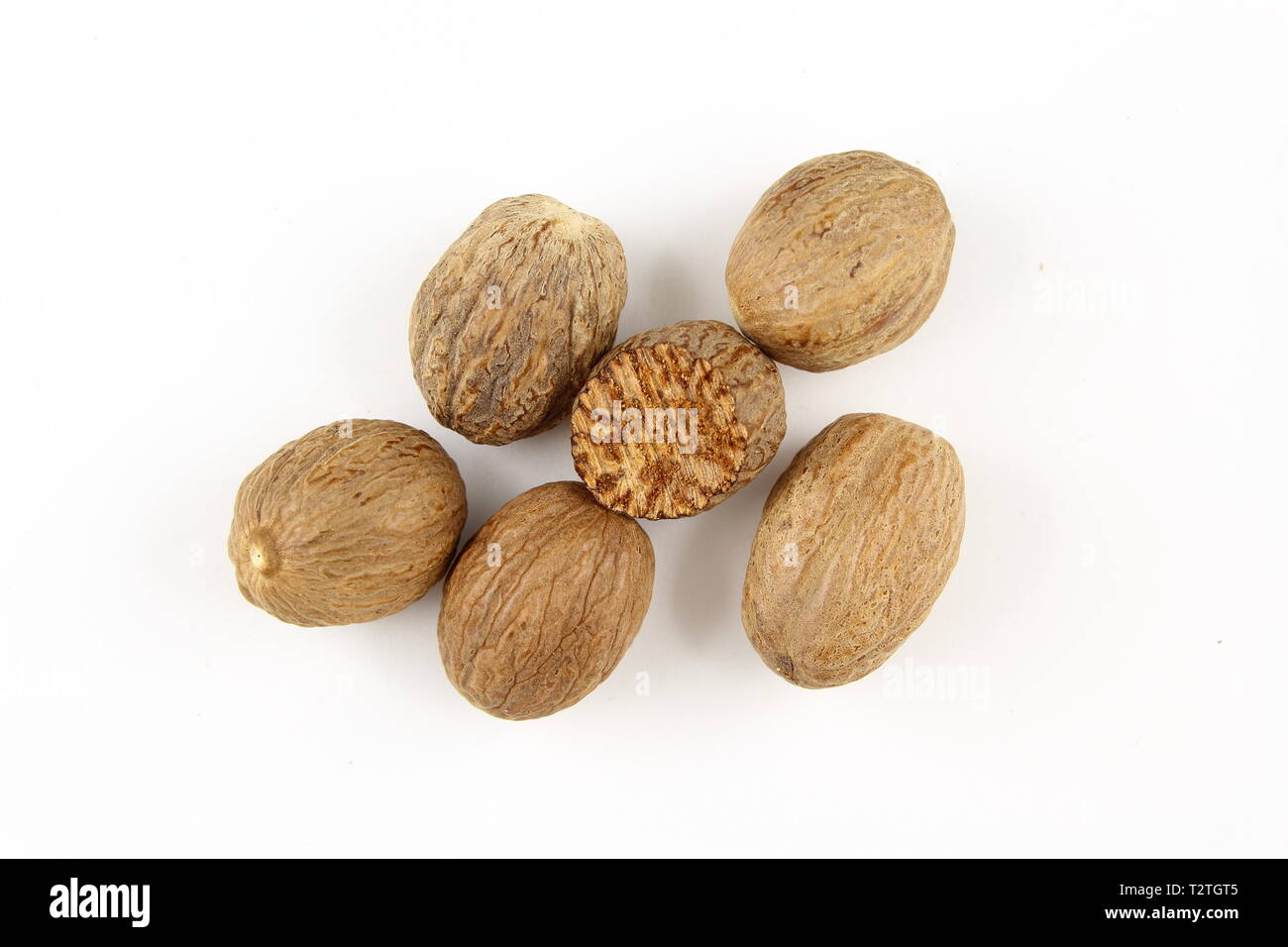composition of nutmeg seeds isolated on a white background Stock Photo ...