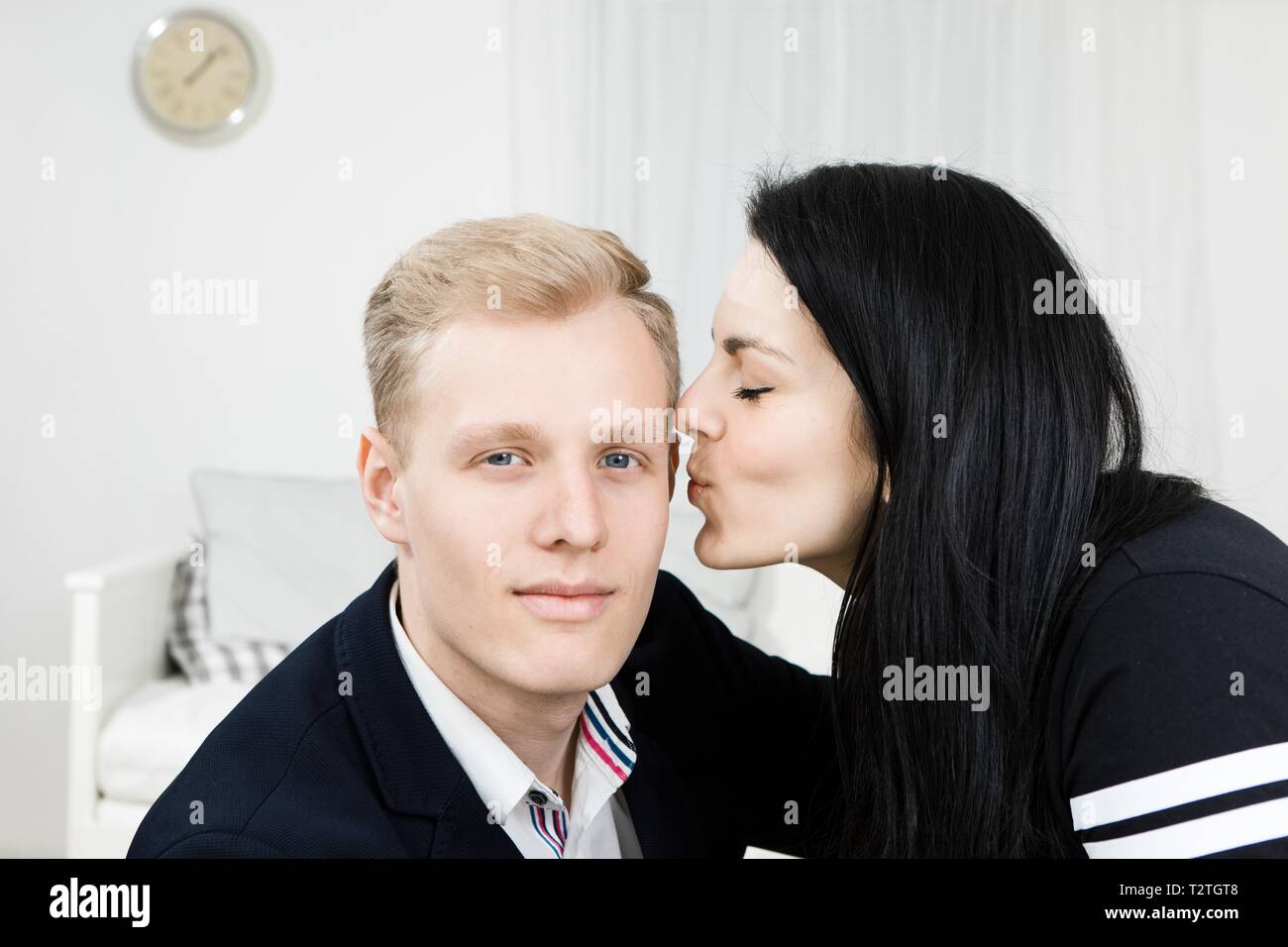 Young attractive businesswoman kissing man in formal dress - love on ...