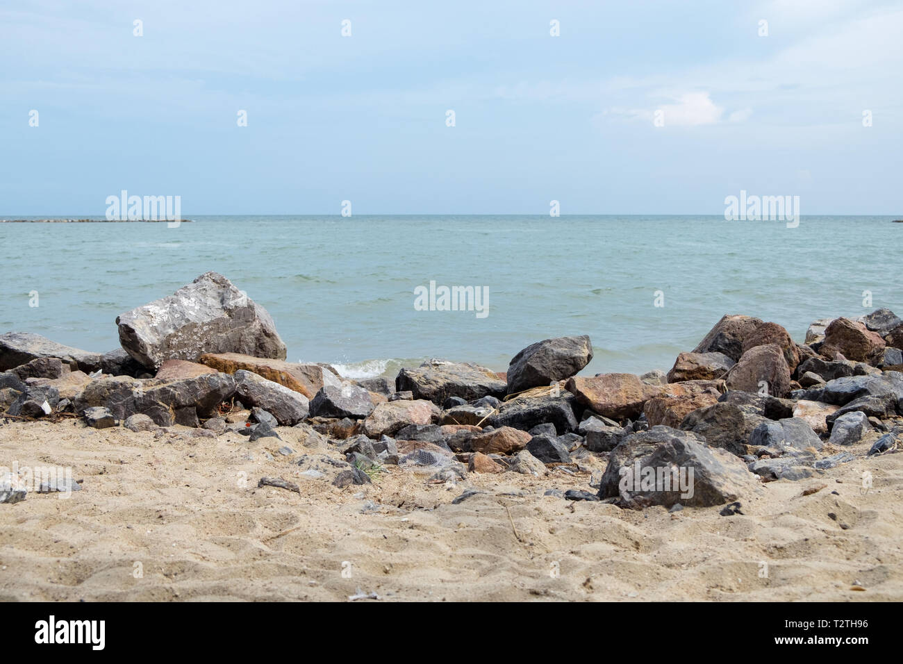 Many big rock on sand beach Stock Photo - Alamy