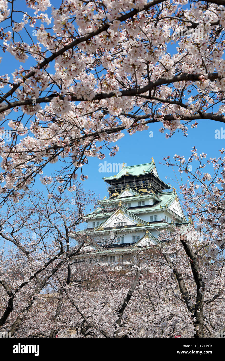 Osaka, Japan. 4th Apr, 2019. Osaka Castle seen through the branches of ...