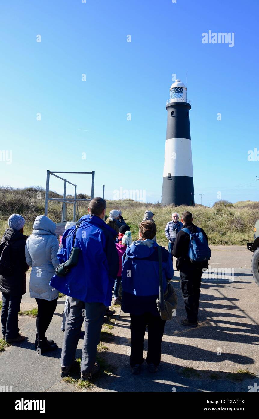 Visitors to the disused and redundant lighthouse at Spurn Point or ...