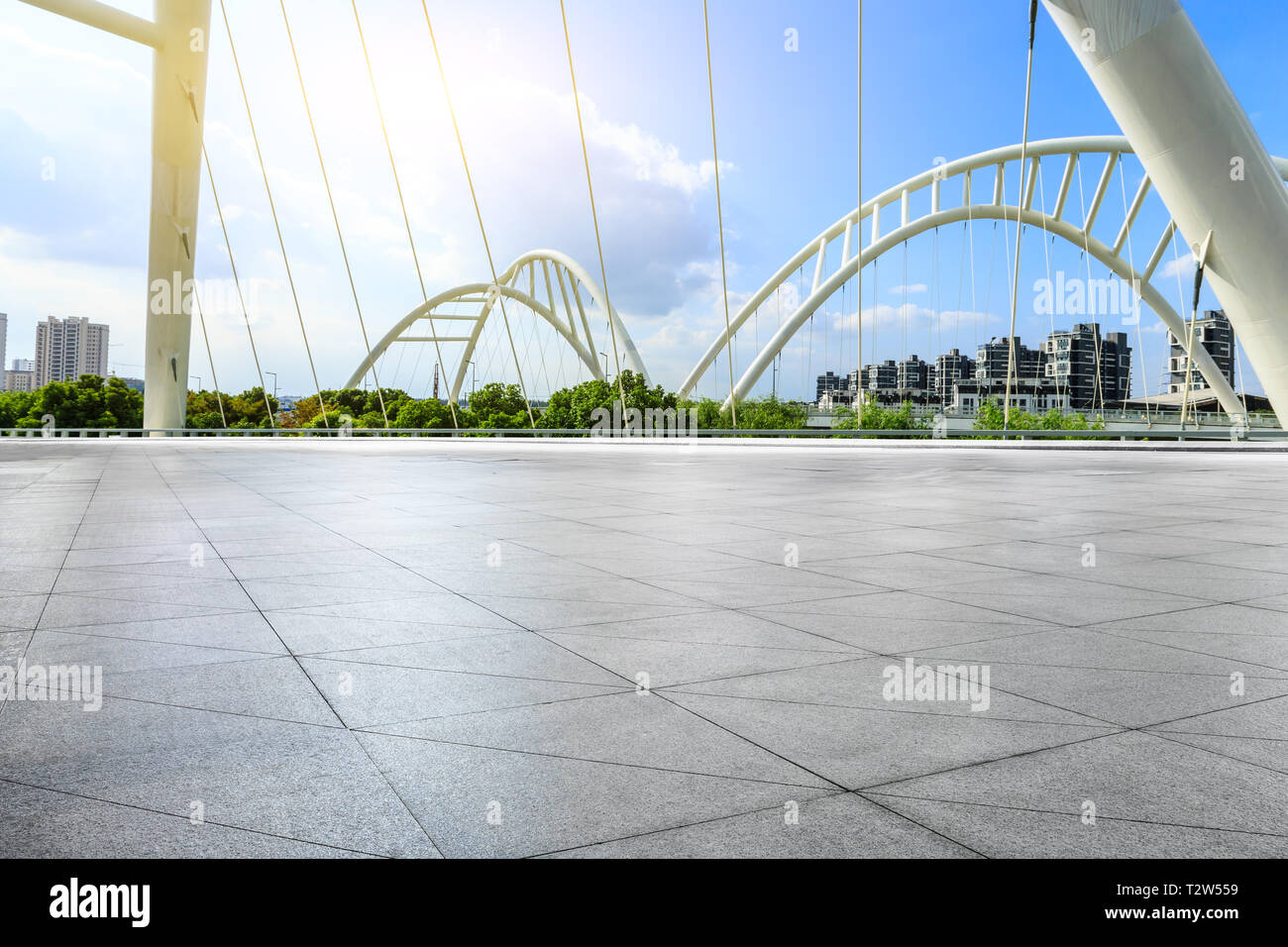 Empty square floor and bridge construction in shanghai Stock Photo - Alamy