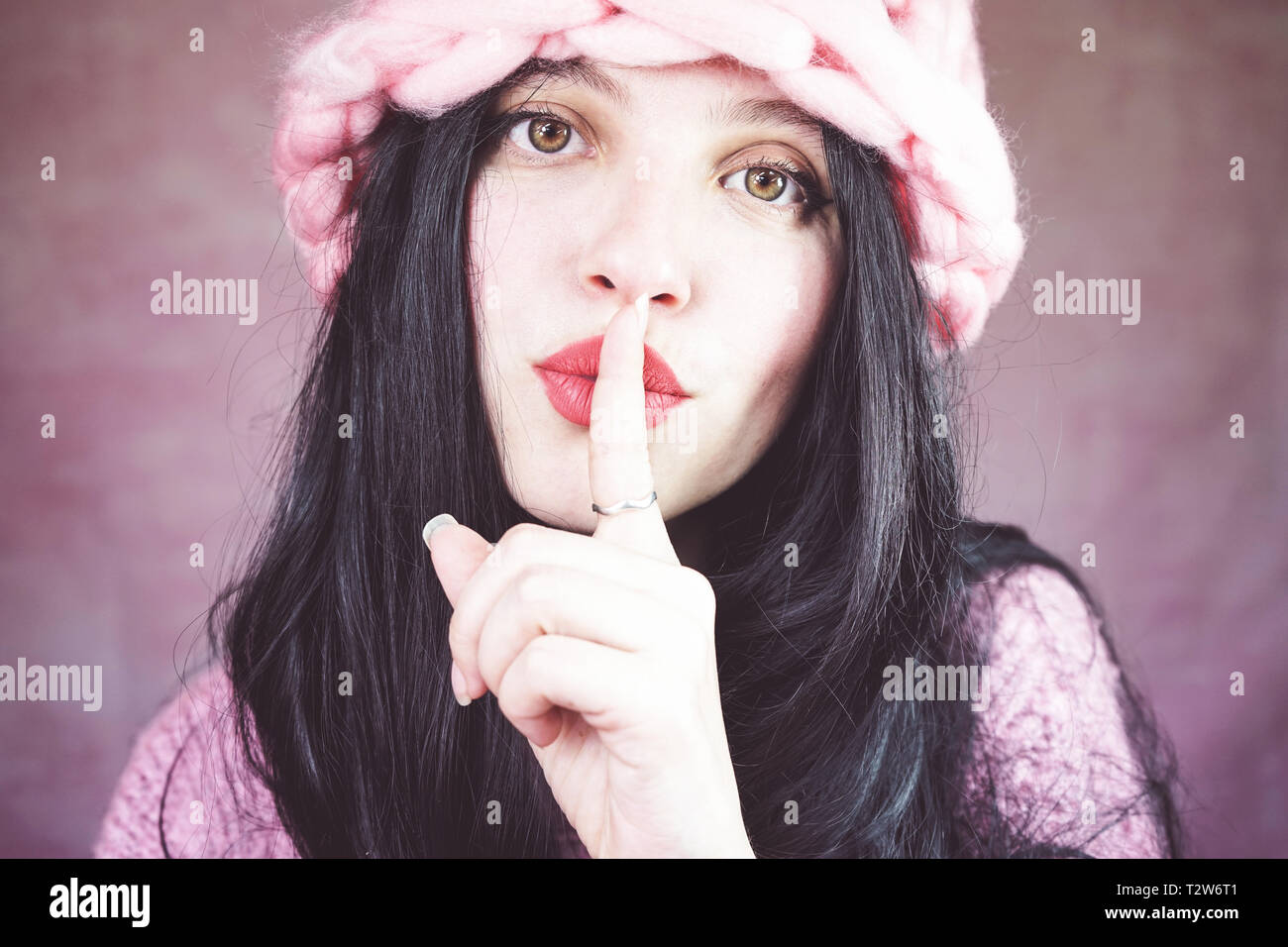 Beautiful young woman doing secret hi-res stock photography and images ...