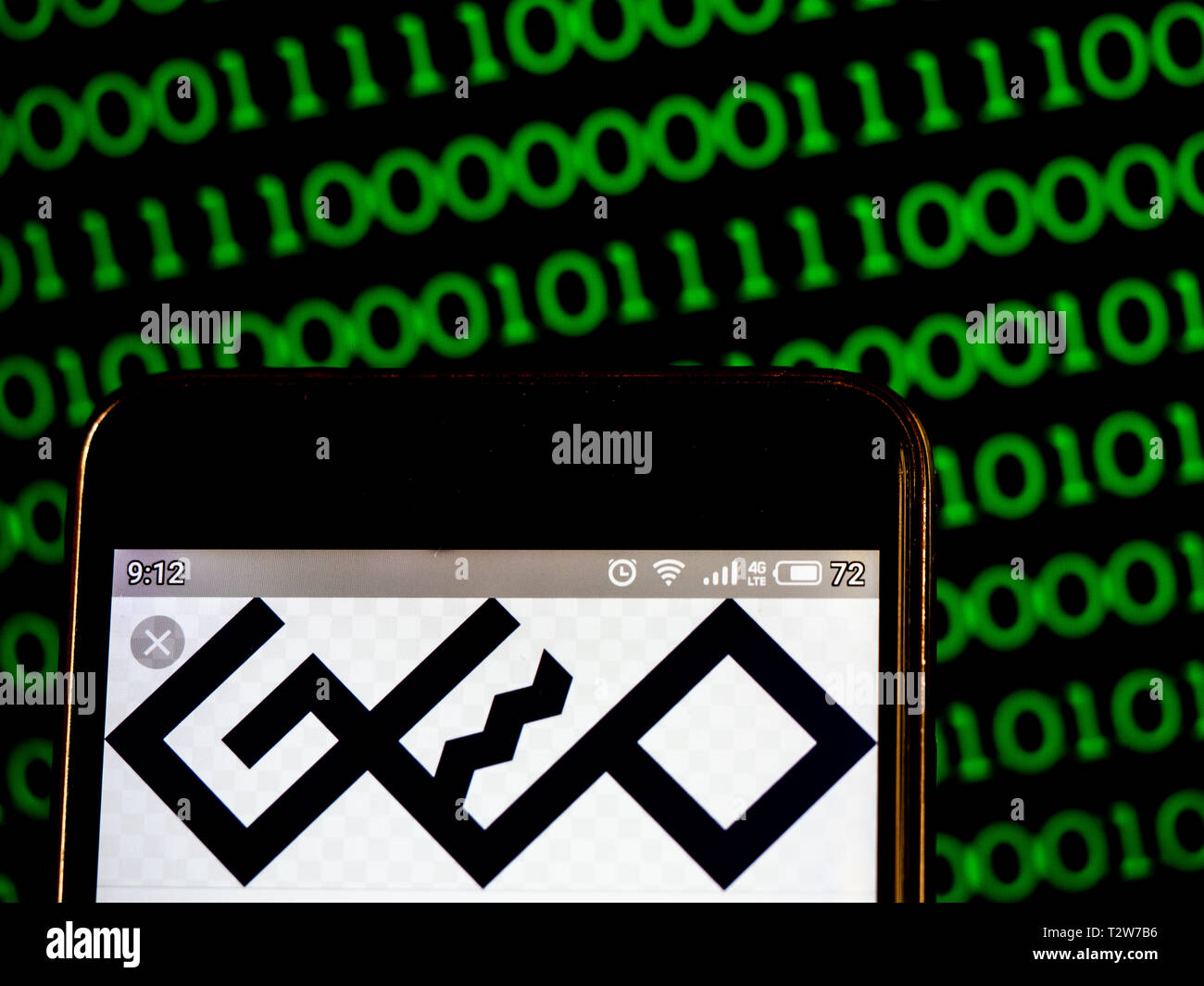 In this photo illustration a Geo Corporation logo seen displayed on a ...