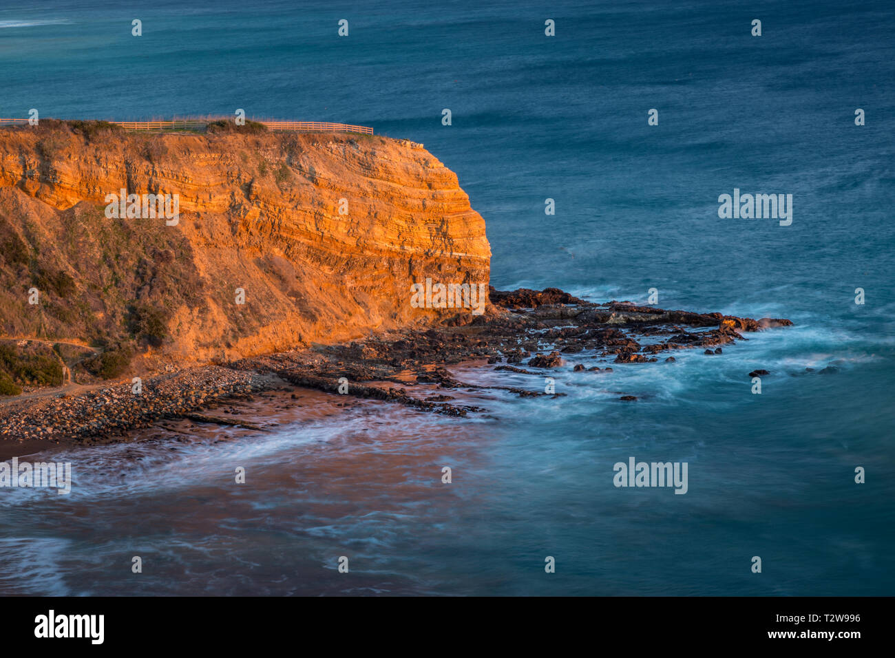 Long exposure photo of Inspiration Point cliff at sunset with waves ...